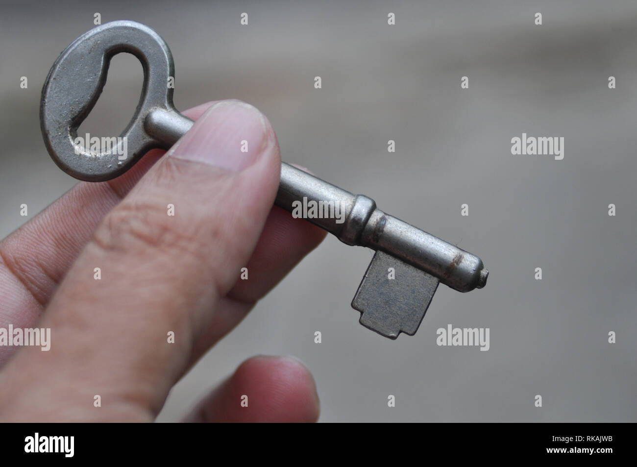 Key on hand Stock Photo - Alamy