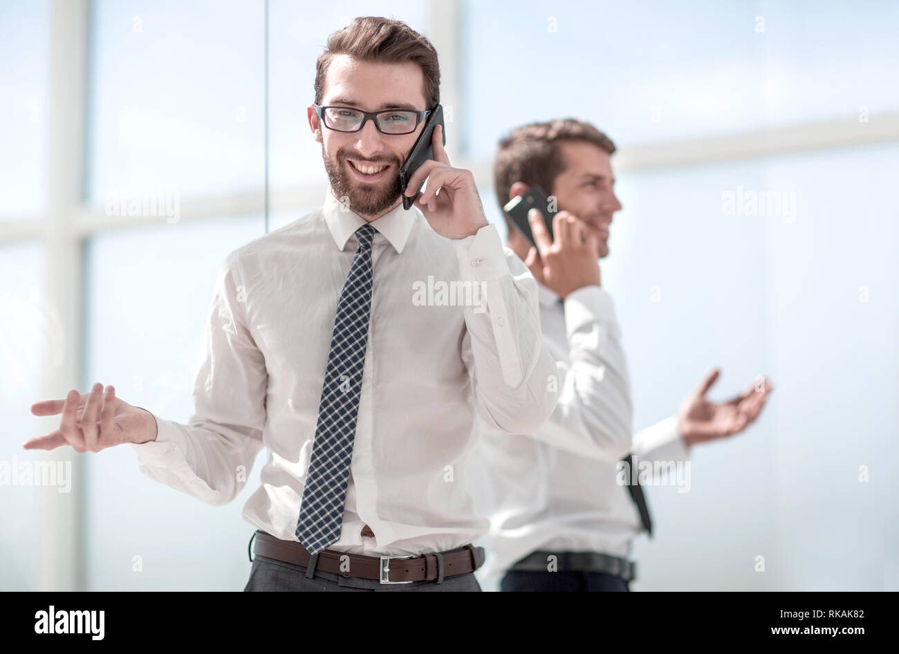 business partners communicating using smartphones.business concept ...