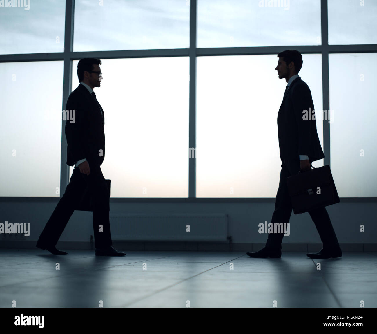Two people walking towards each other hi-res stock photography and ...
