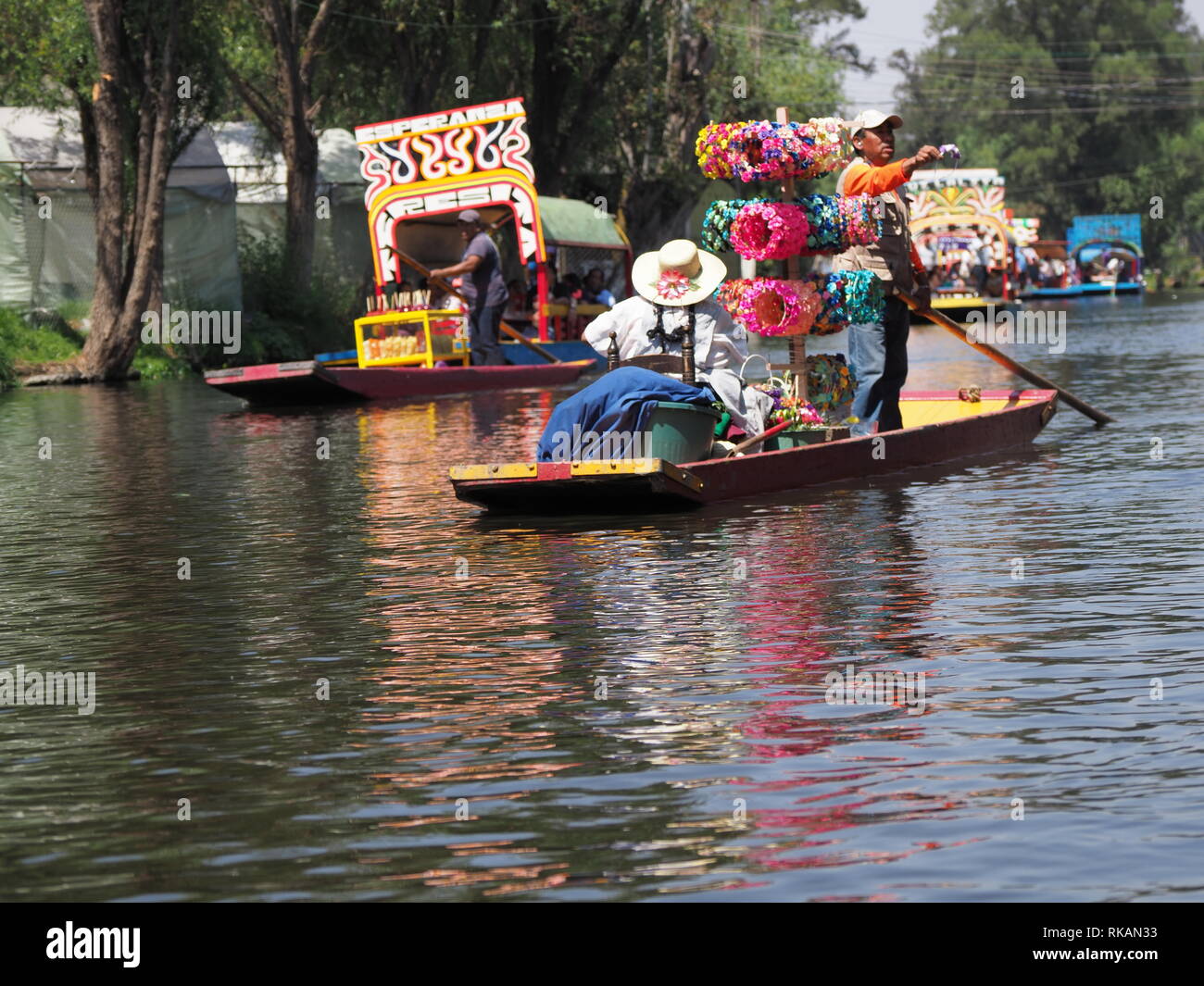 Colorful several mexican boats with tourists and gondoliers at ...