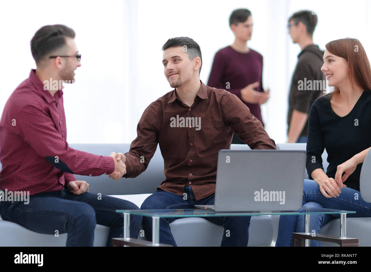creative business team working with a client in the office Stock Photo ...
