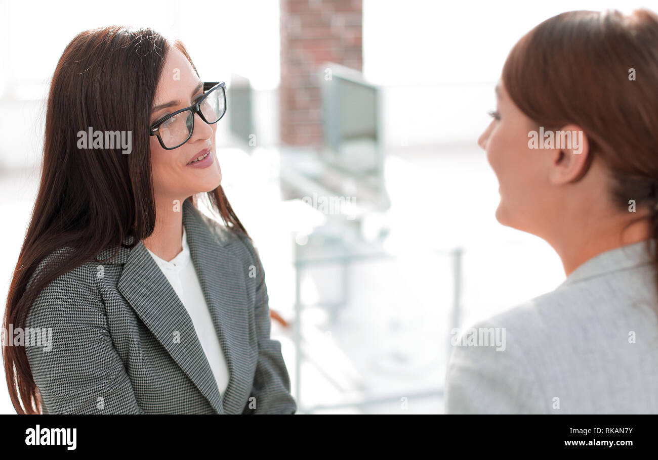 two employees on the background of a modern office.photo with copy ...