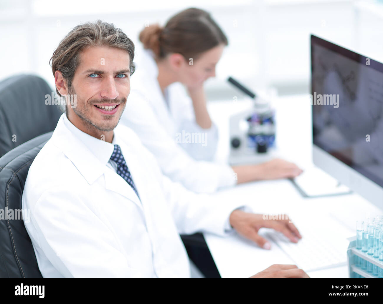 Female Research Scientist Looks at Biological Samples Under Microscope ...