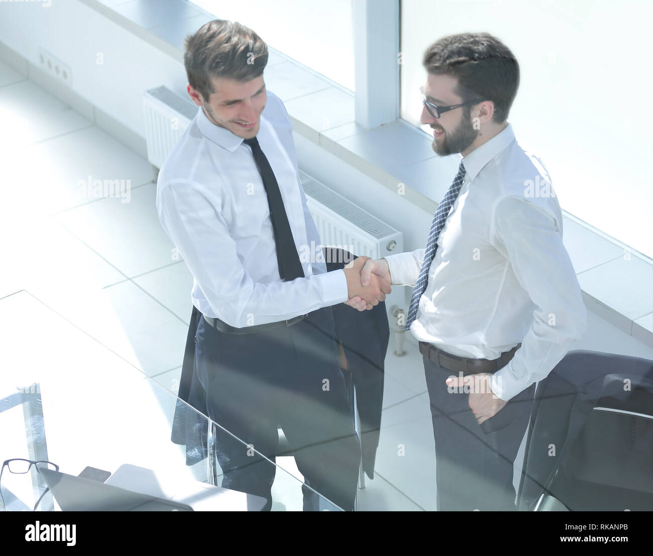 welcome handshake business people in the office.photo with space for ...