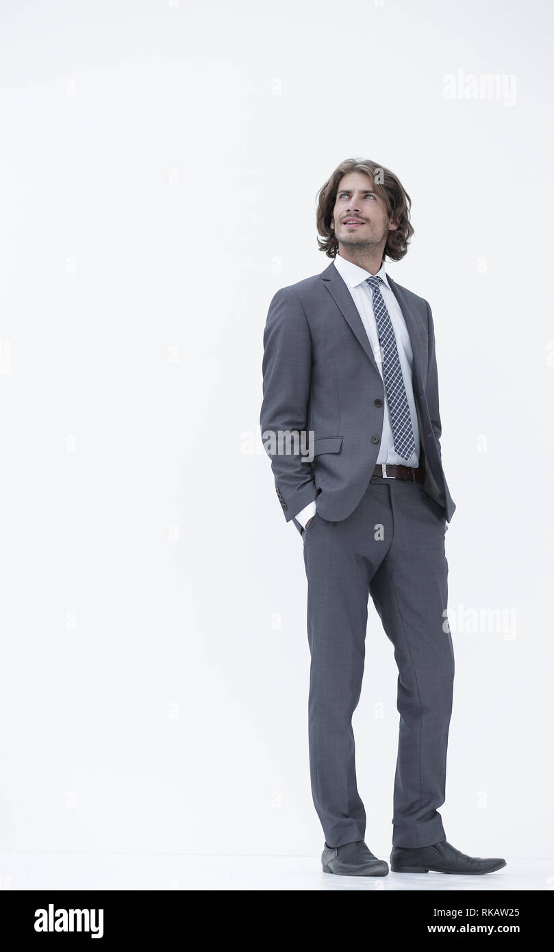 Full body young businessman looking up. Standing isolated on white ...