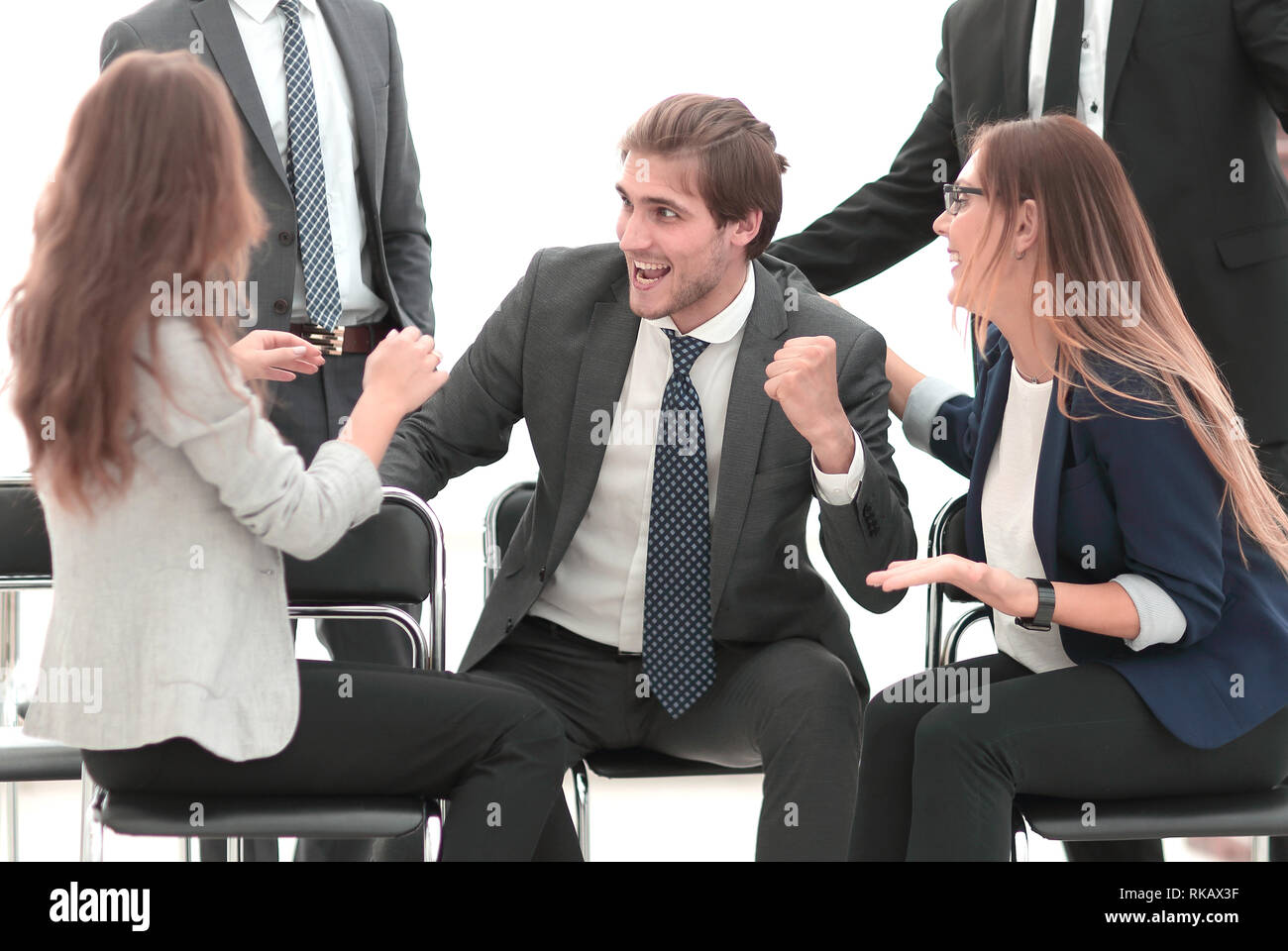 young colleagues embrace when meeting at the office Stock Photo - Alamy