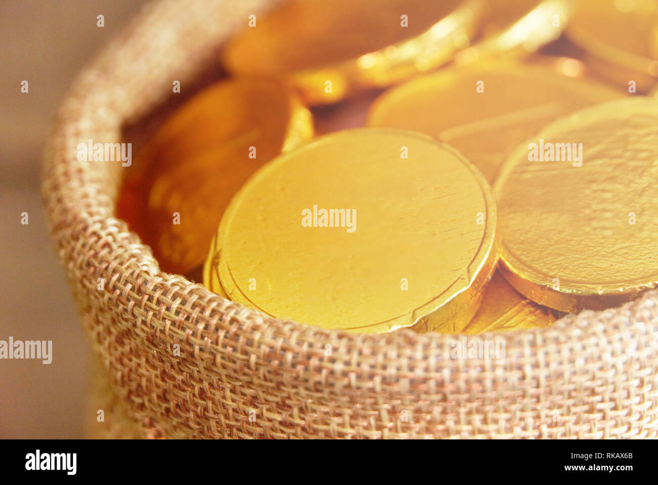 Topview gold coin in canvas bag Stock Photo - Alamy