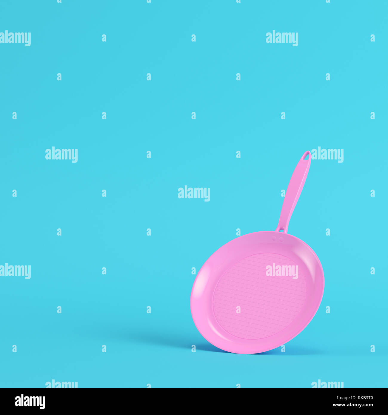Pink frying pan on bright blue background in pastel colors. Minimalism ...