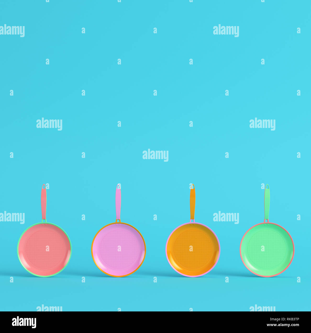 Four colorful frying pans on bright blue background in pastel colors ...