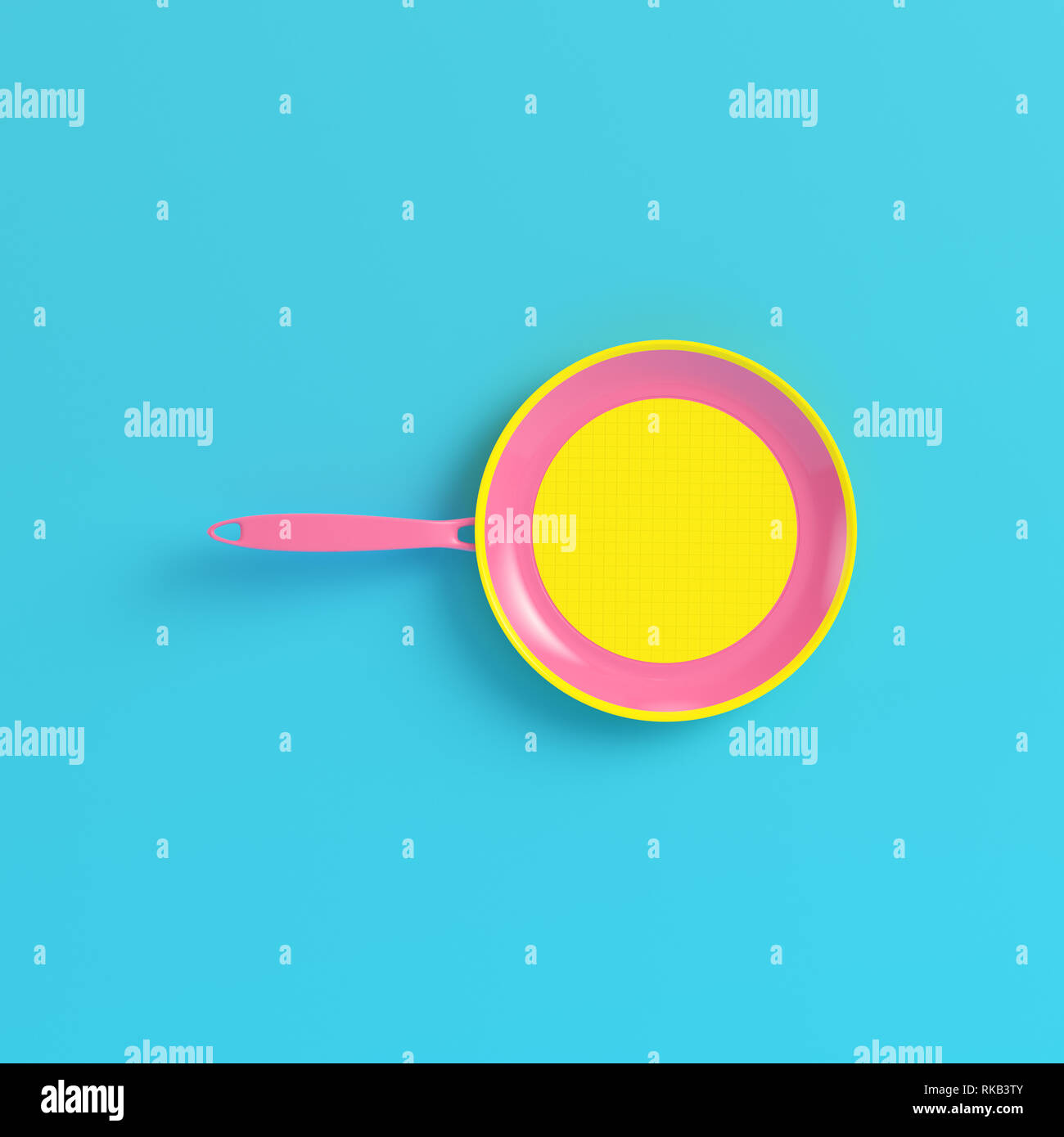 Yellow frying pan on bright blue background in pastel colors ...