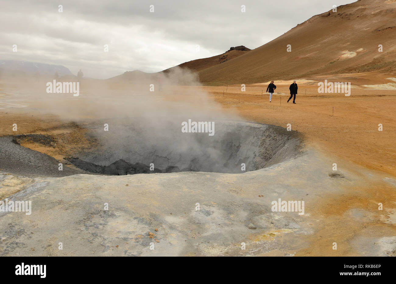 Boiling mud pots at Namafjall, a popular tourist spot in Iceland Stock ...