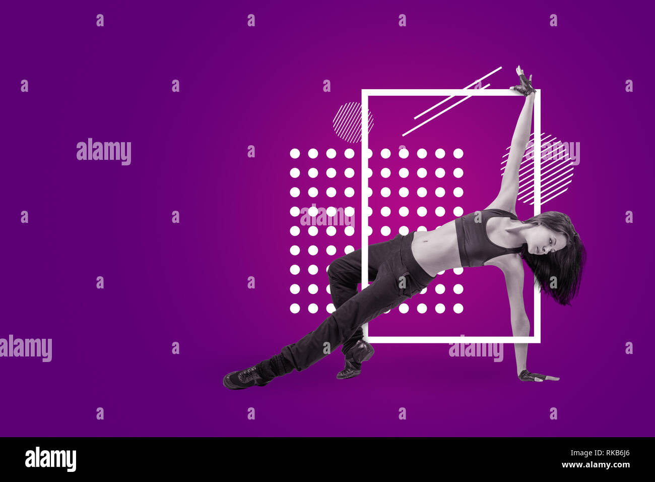 A young attractive female dancer doing a downrock dance move on a ...