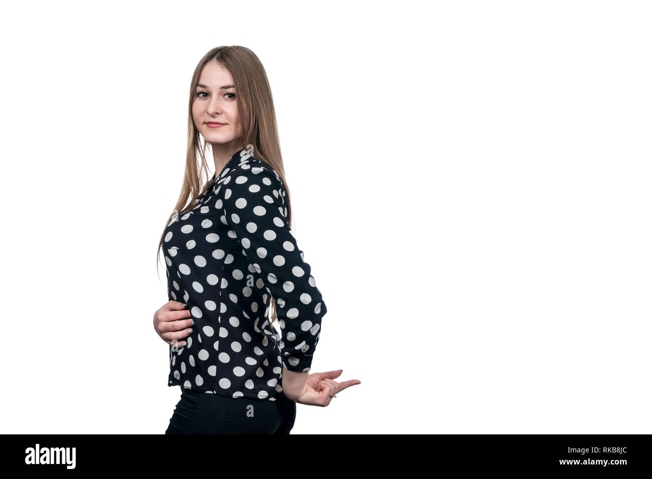 business woman points finger to the side behind her back isolated on ...