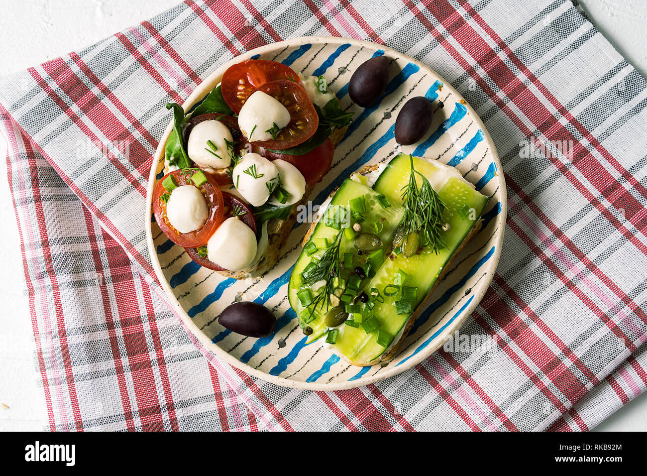Variety of sandwiches or tapas with bread , cream cheese, vegetable and ...