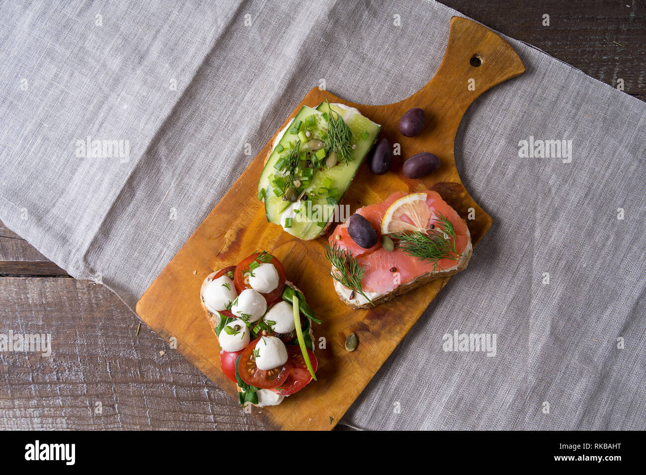 Variety of sandwiches or tapas with bread , cream cheese, vegetable and ...