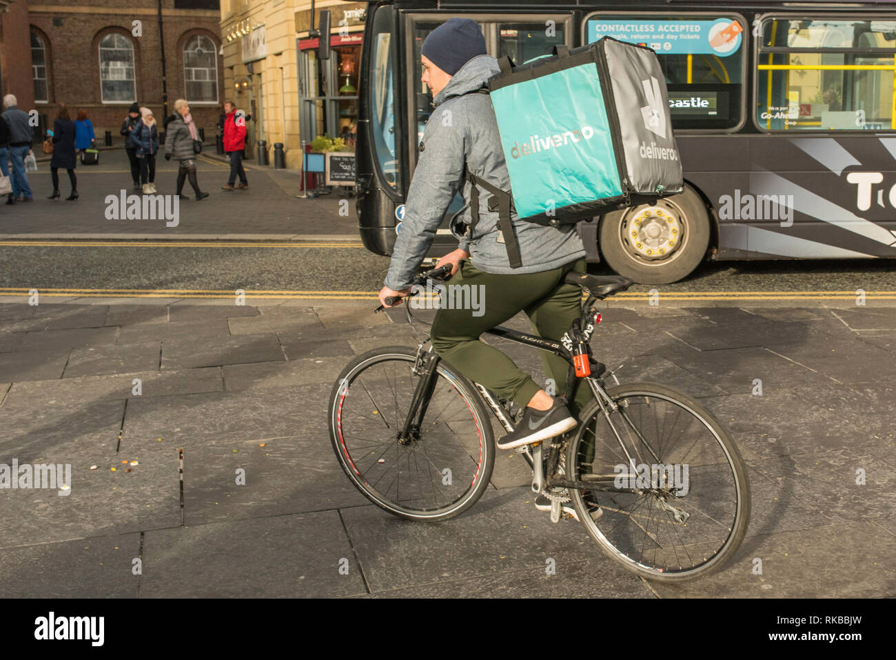 Man with a Deliveroo box on his back in Newcastle City Centre, England ...