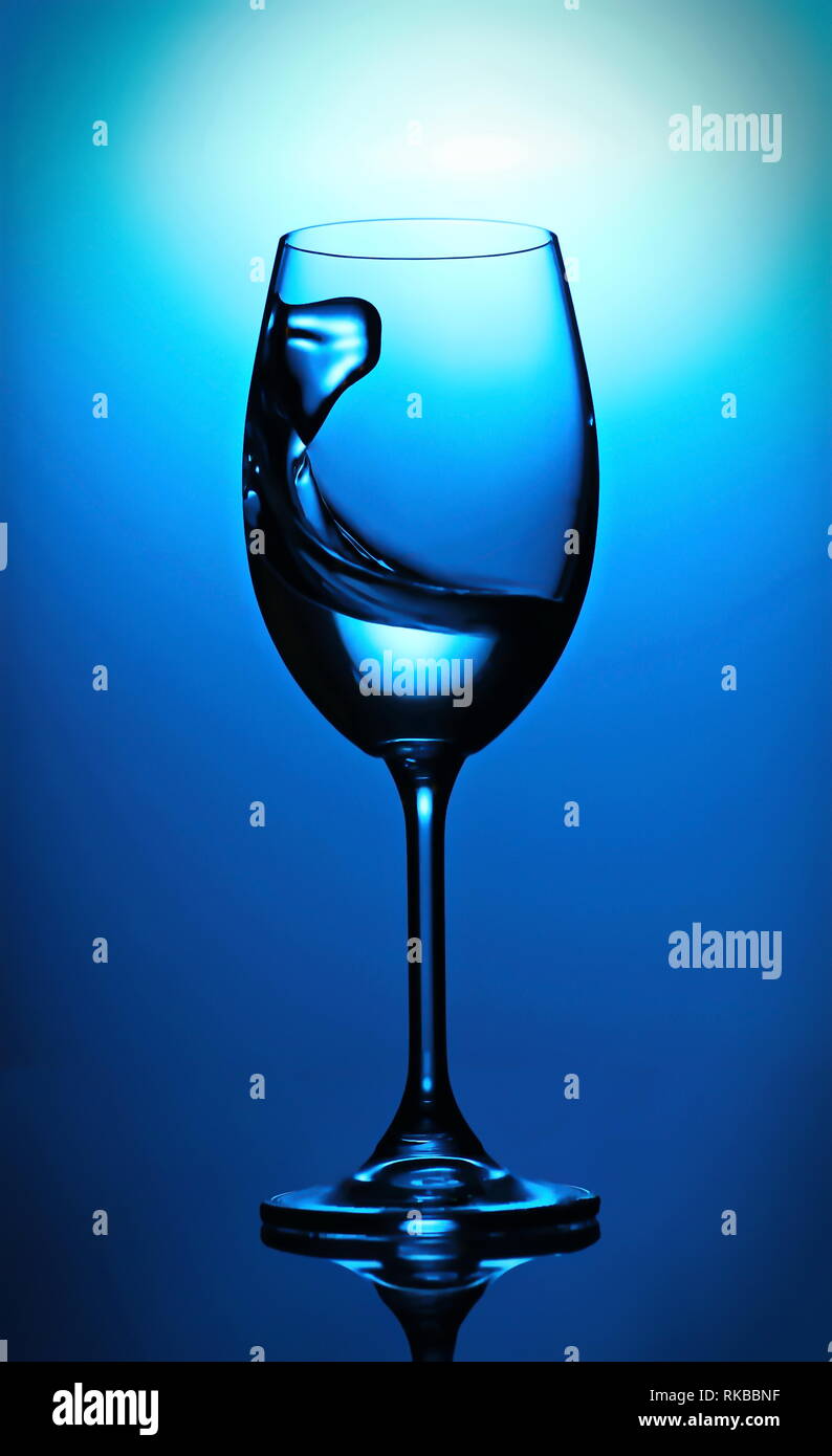 Cheers A Toast with blue Wine, Splash Stock Photo - Alamy