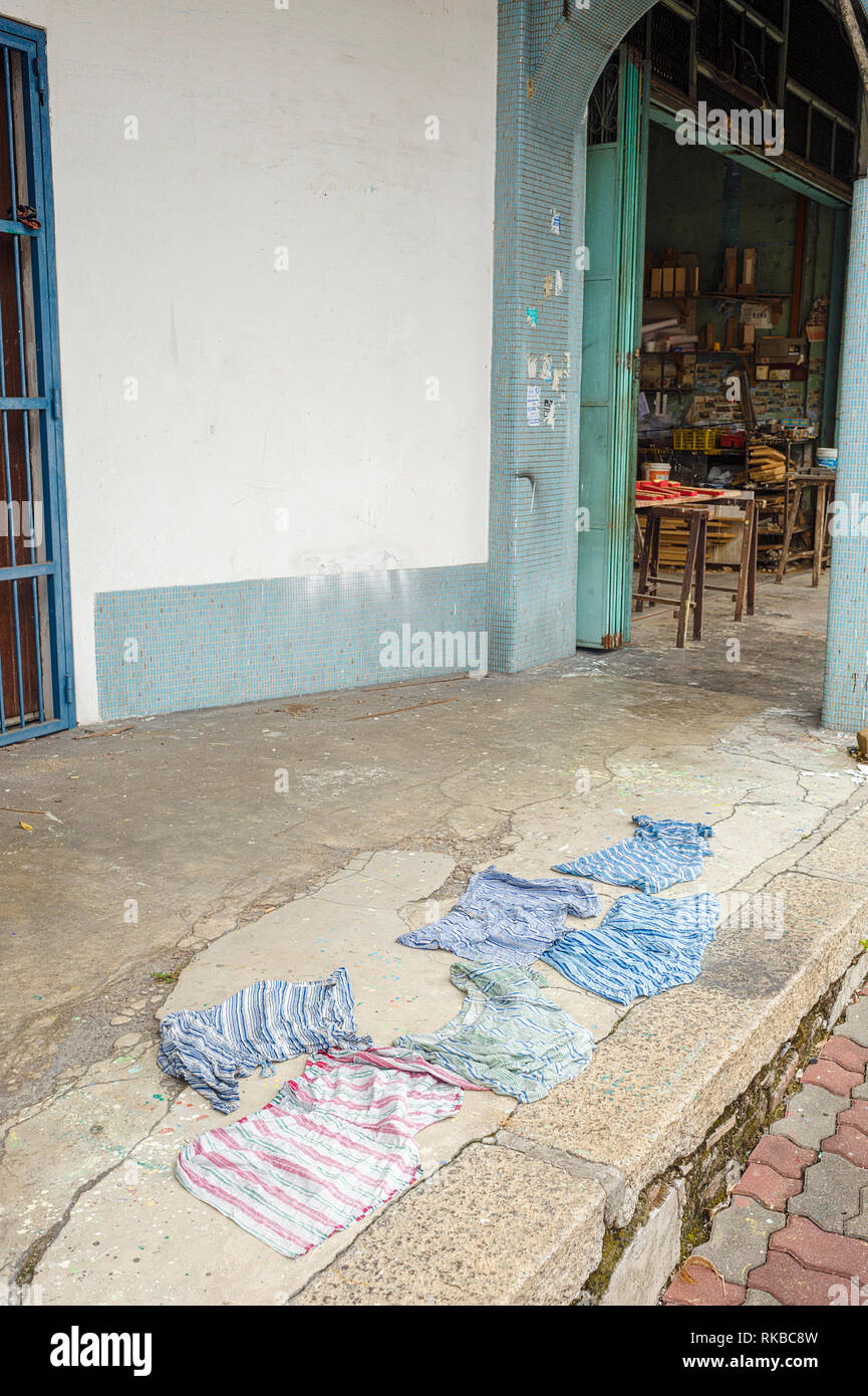 laundry drying on a sidewalk in old town of Ipoh, Perak, Malaysia Stock ...