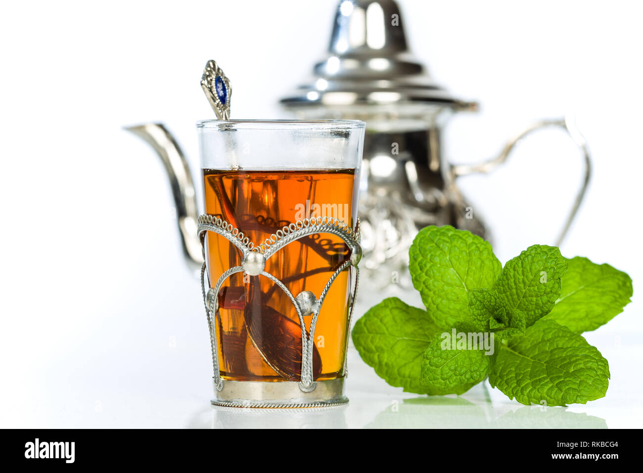 Traditional refreshing Arabic mint tea. Isolated on the white ...