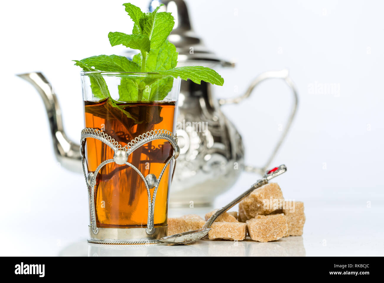 Traditional refreshing Arabic mint tea. Isolated on the white ...