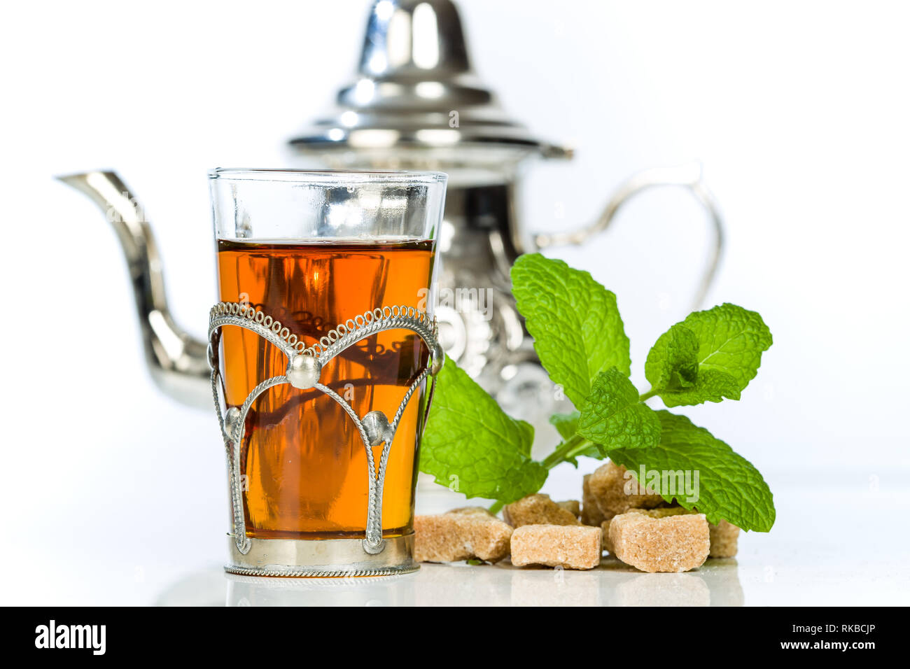Traditional refreshing Arabic mint tea. Isolated on the white ...