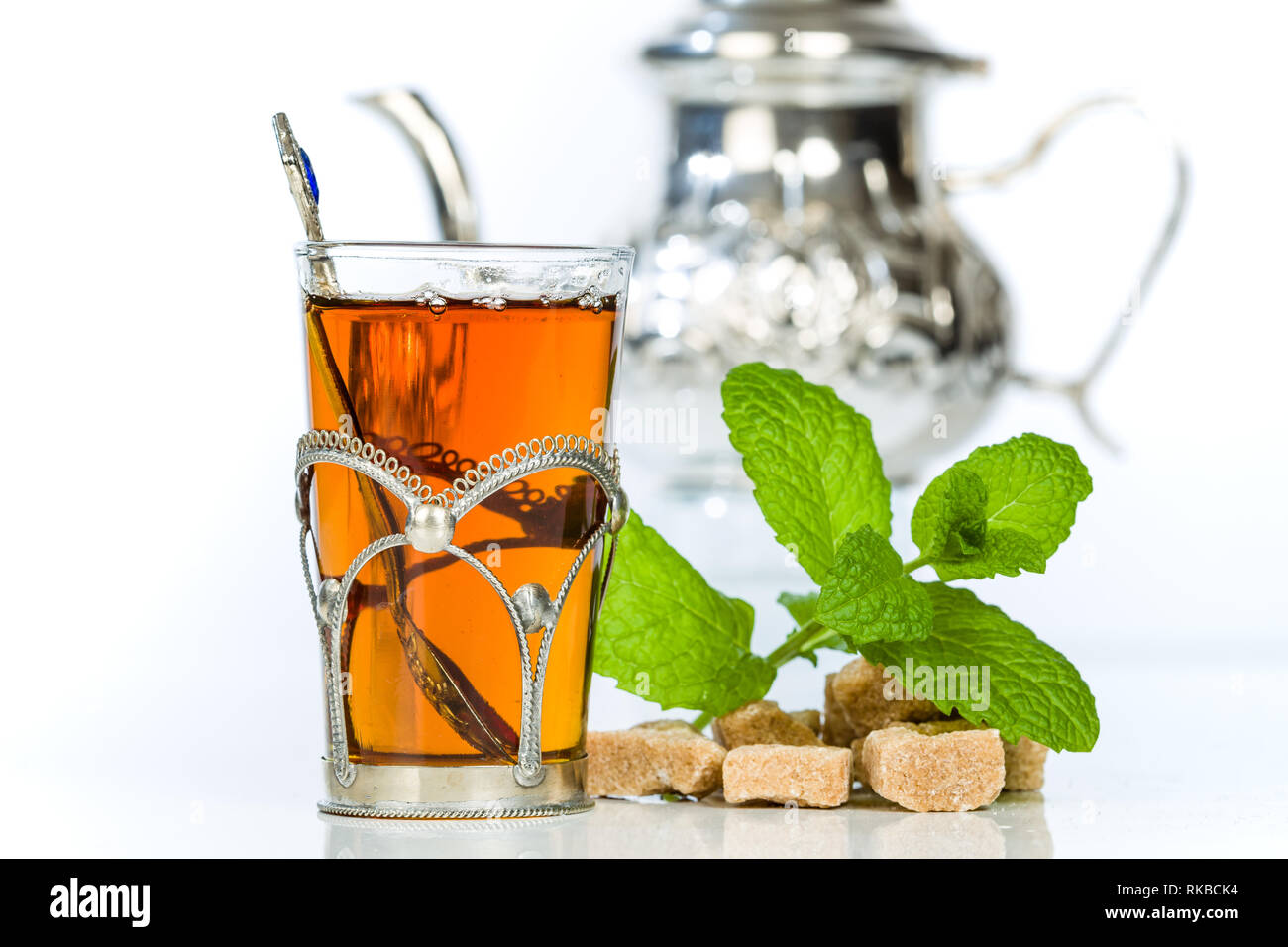 Traditional refreshing Arabic mint tea. Isolated on the white ...