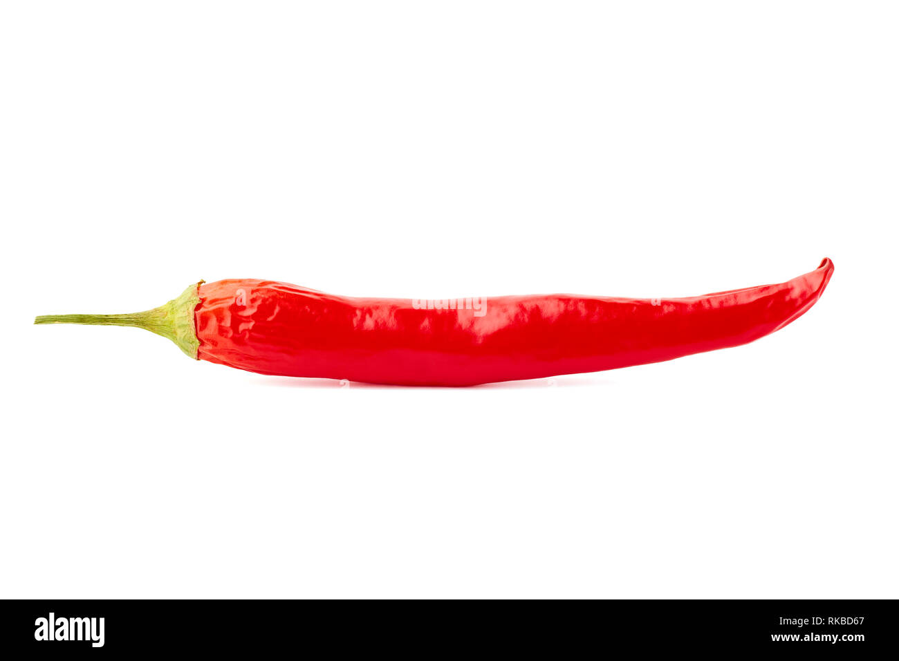 Single chilli pepper shuck on white background Stock Photo - Alamy