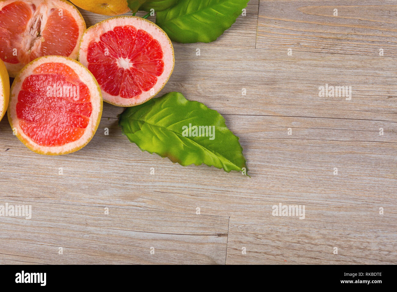 grapefruit on wooden table Stock Photo - Alamy
