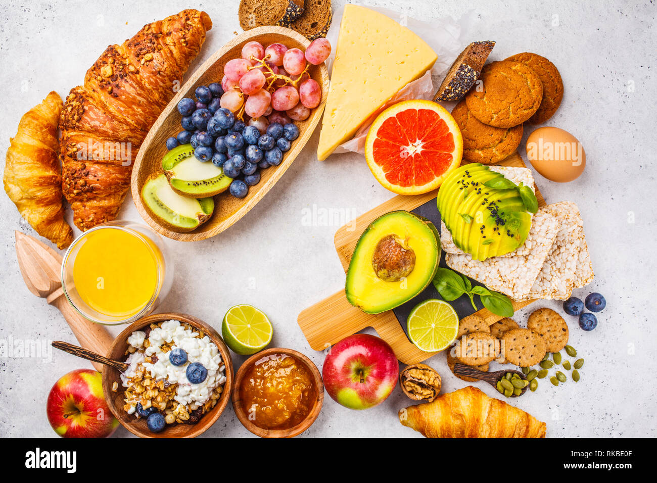 Healthy balanced breakfast on a white background. Muesli, juice ...