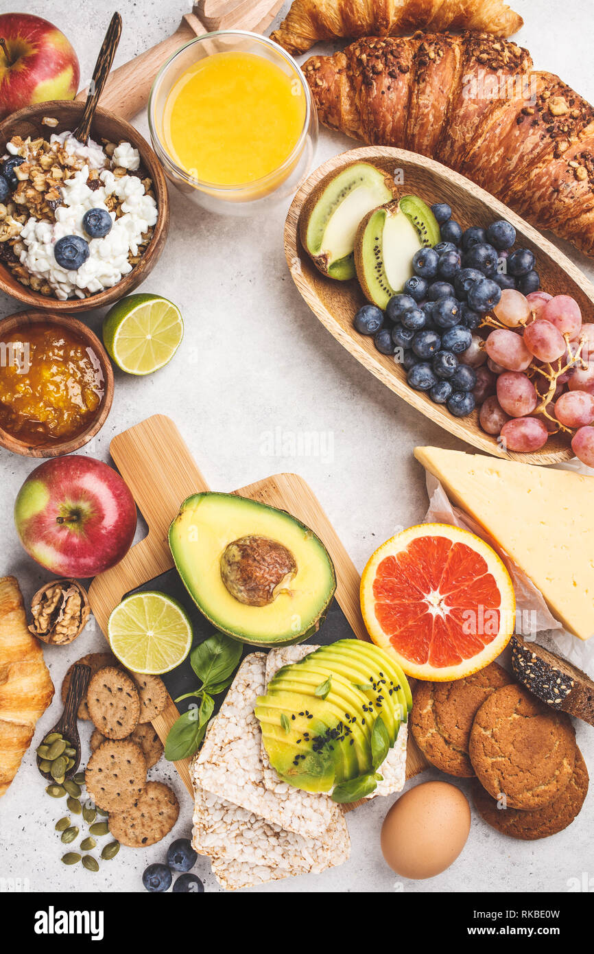 Healthy balanced breakfast on a white background. Muesli, juice ...