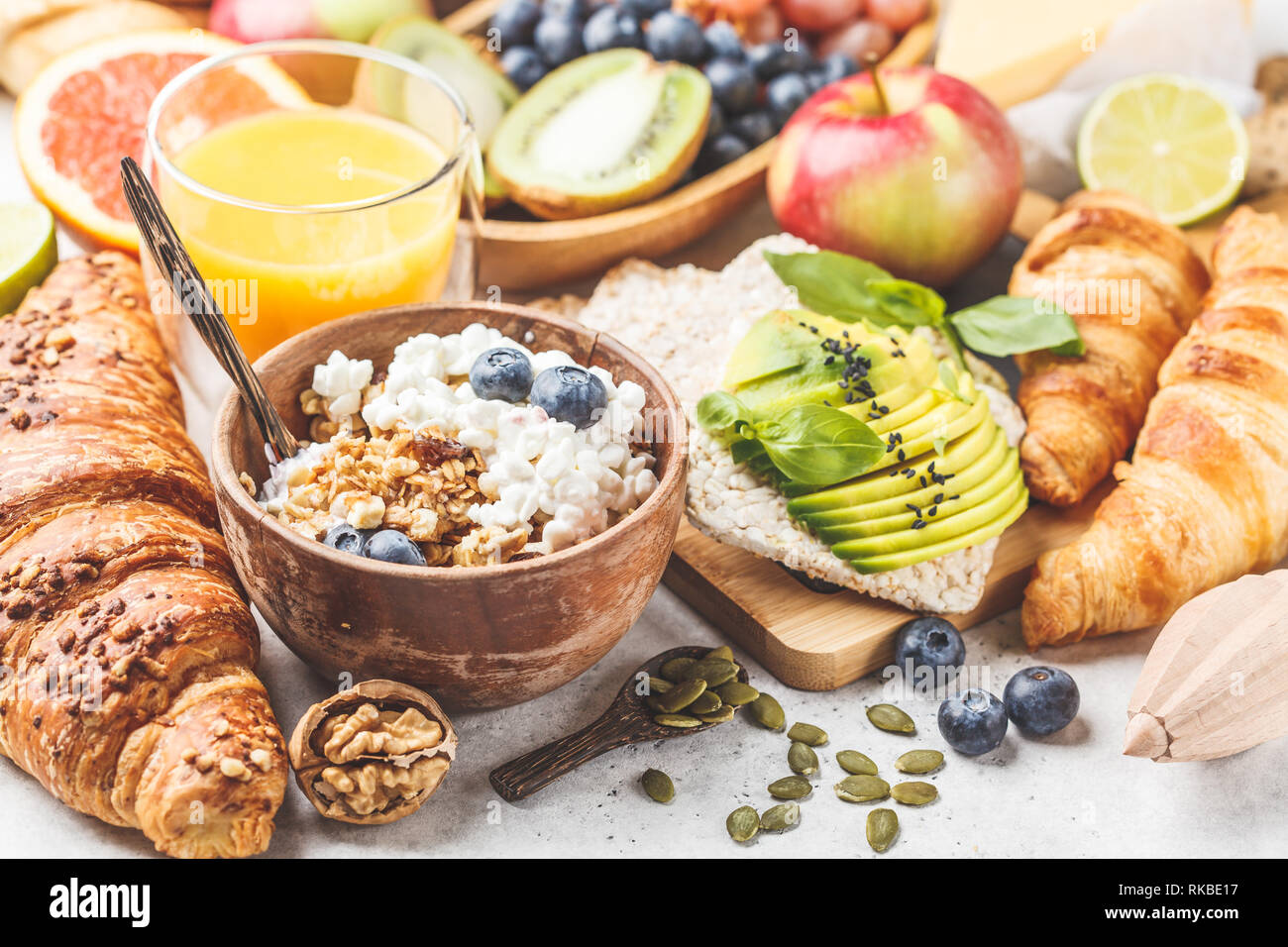 Healthy balanced breakfast on a white background. Muesli, juice ...