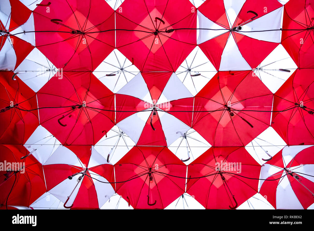 Red and white umbrella hi-res stock photography and images - Alamy