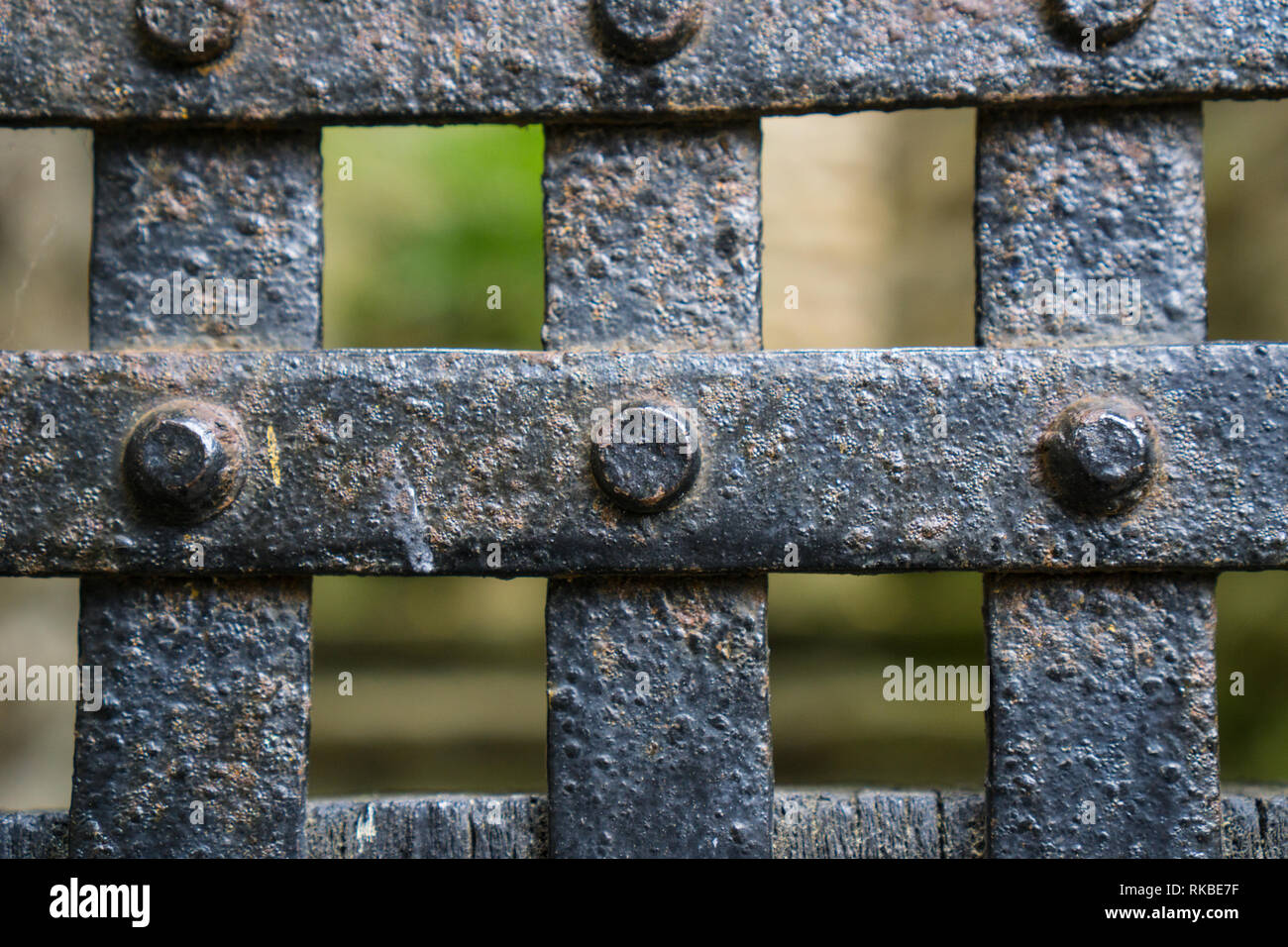 Rusty iron gate closed for security Stock Photo - Alamy