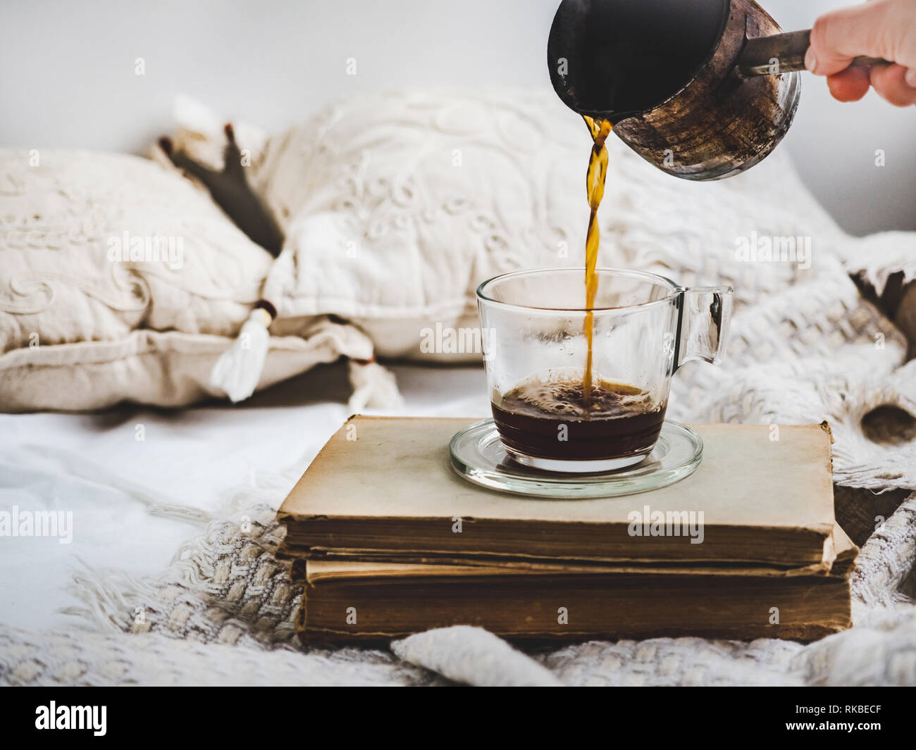 Female hand pouring fragrant coffee in a cup Stock Photo - Alamy