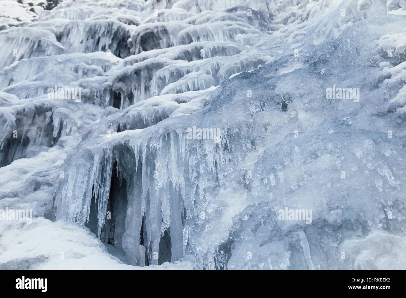 Multiplr, linear layers from the bottom of a frozen waterfall in icy ...