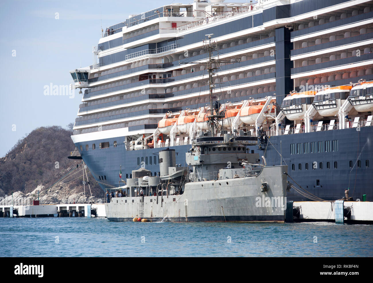 The cruise ship and Mexican navy ship moored in Bahia de Santa Cruz ...