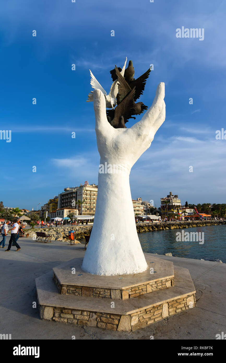 KUSADASI, TURKEY - MAY 23, 2015: The hand of peace sculpture with doves ...