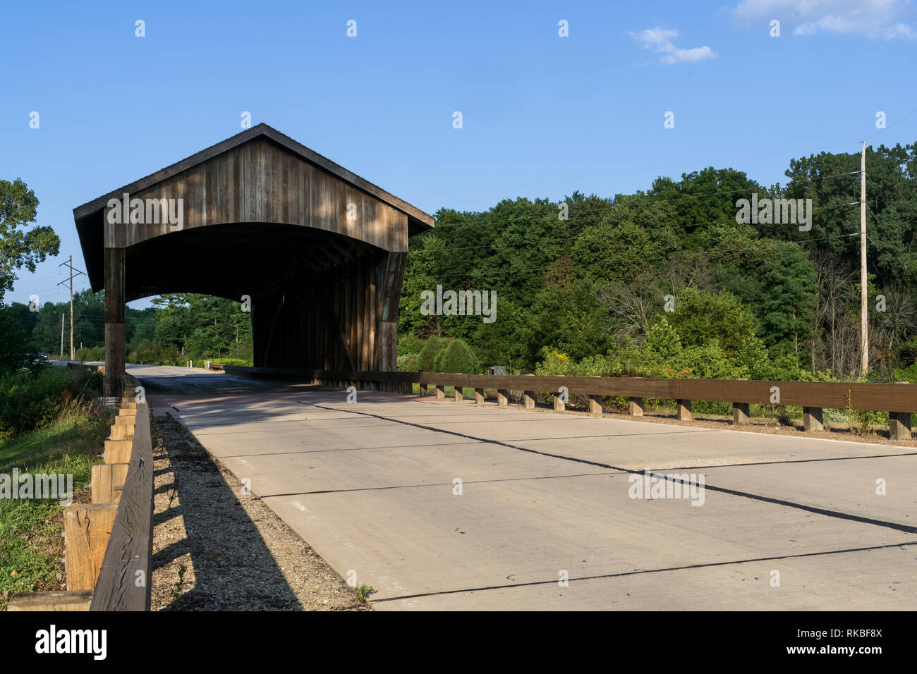 Modern wooden covered bridge made with traditional techniques in rural ...