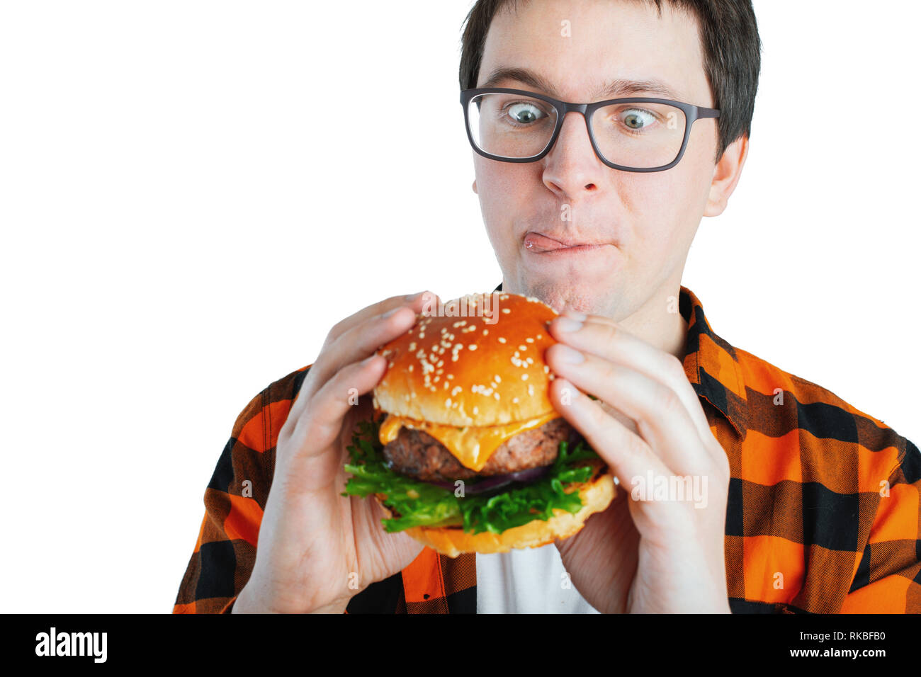 Young man eats junk food hi-res stock photography and images - Alamy