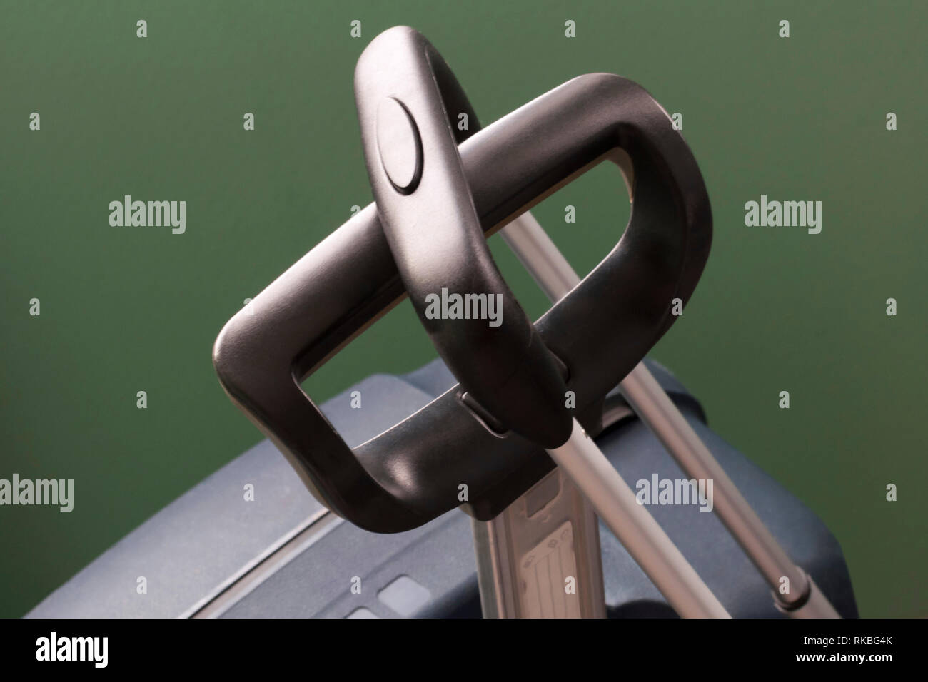 Ready-made travel suitcases with handles extended. Selective focus ...