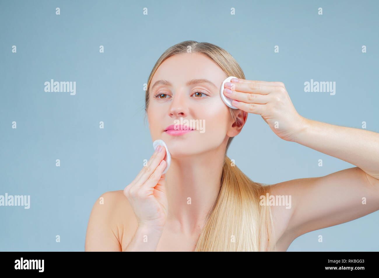 Beautiful woman removing makeup from her face, skin care concep Stock ...