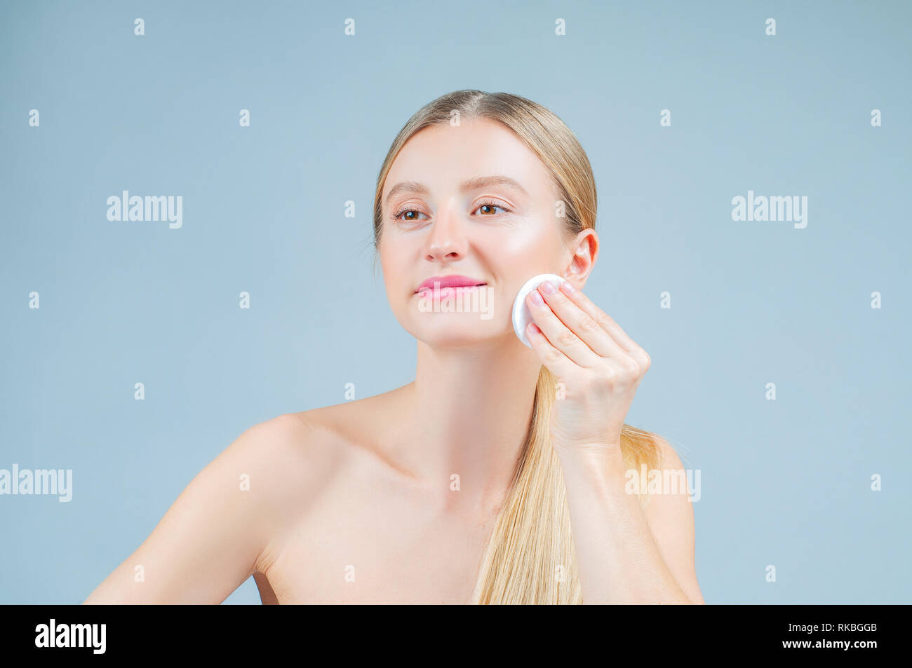 Beautiful woman removing makeup from her face, skin care concep Stock ...