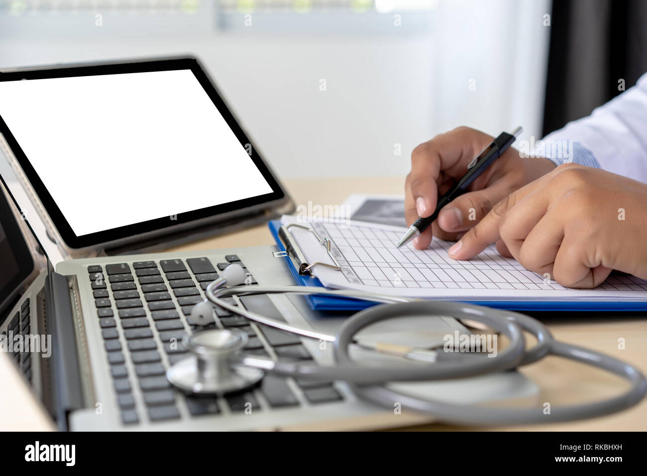 Health care writing prescription Doctor working with laptop computer ...