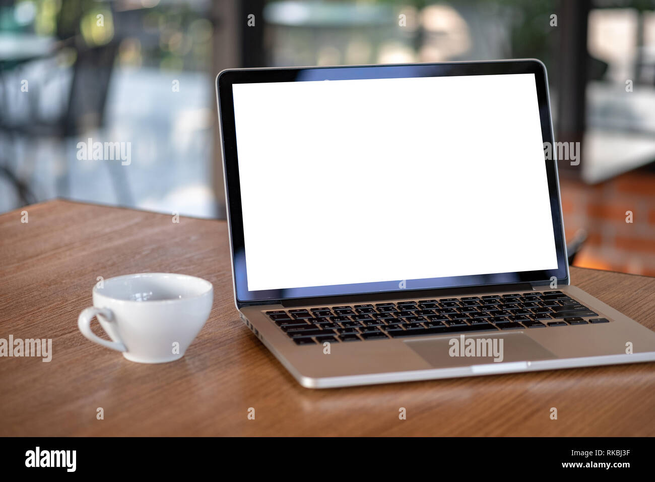 mock up Using laptop with blank screen computer modern Workspace in ...