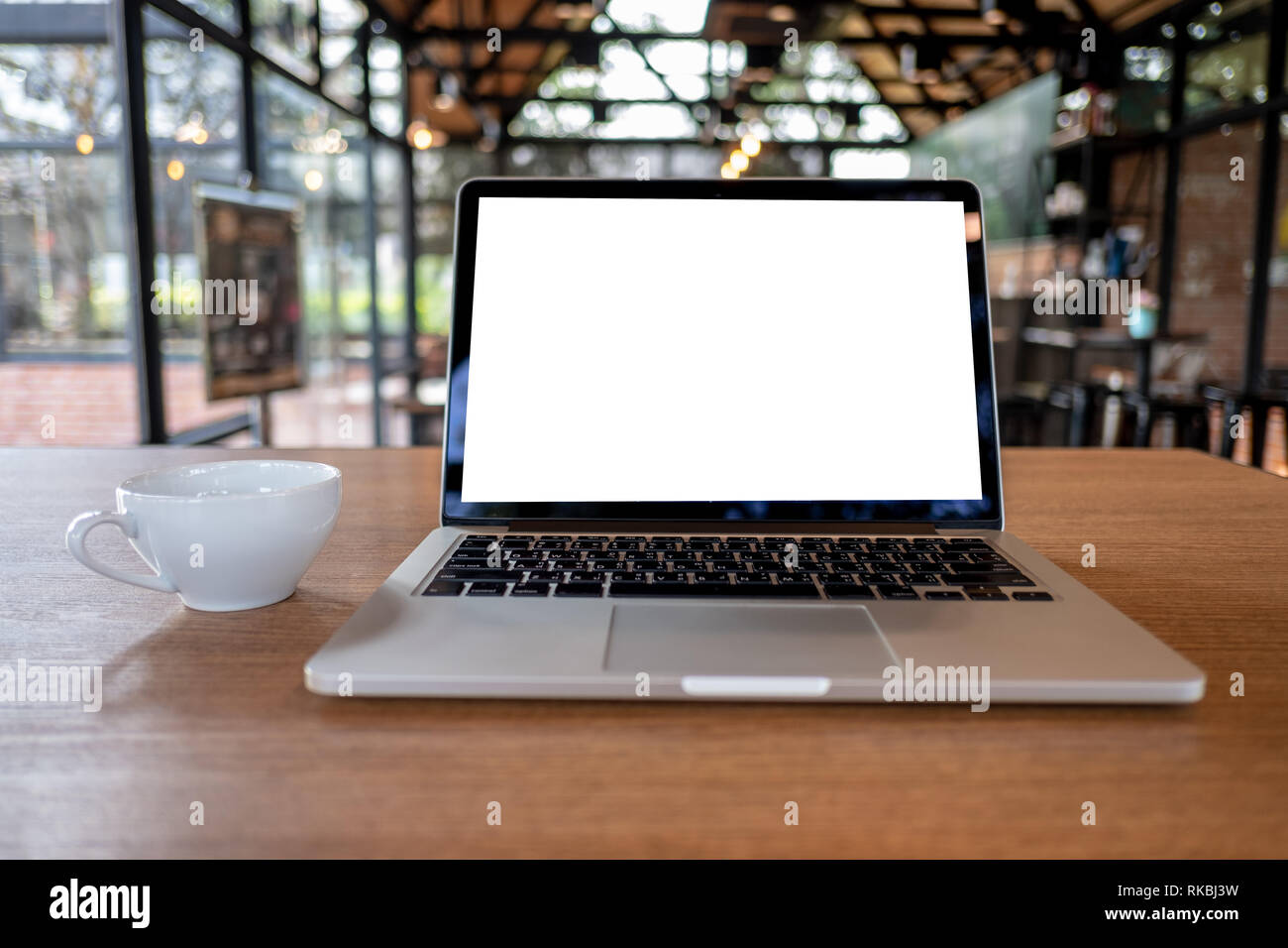 mock up Using laptop with blank screen computer modern Workspace in ...
