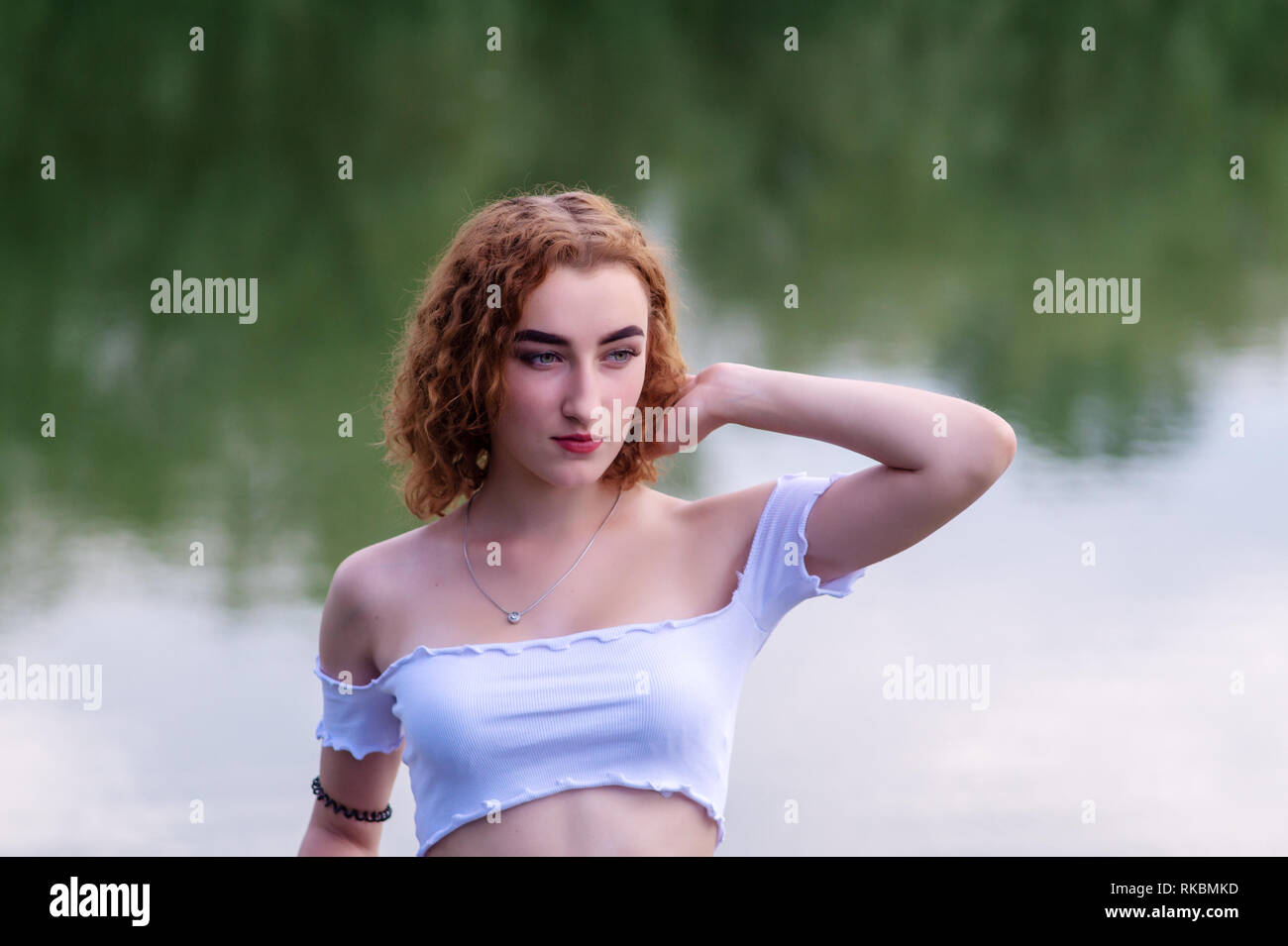 Portrait of a girl, Against the background of water. Correct the spit ...