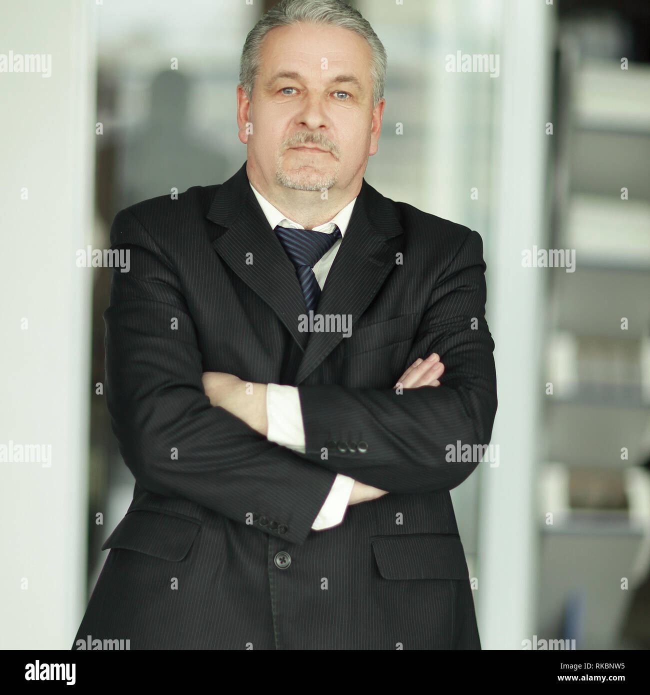 strict businessman on background of office.photo with copy space Stock ...