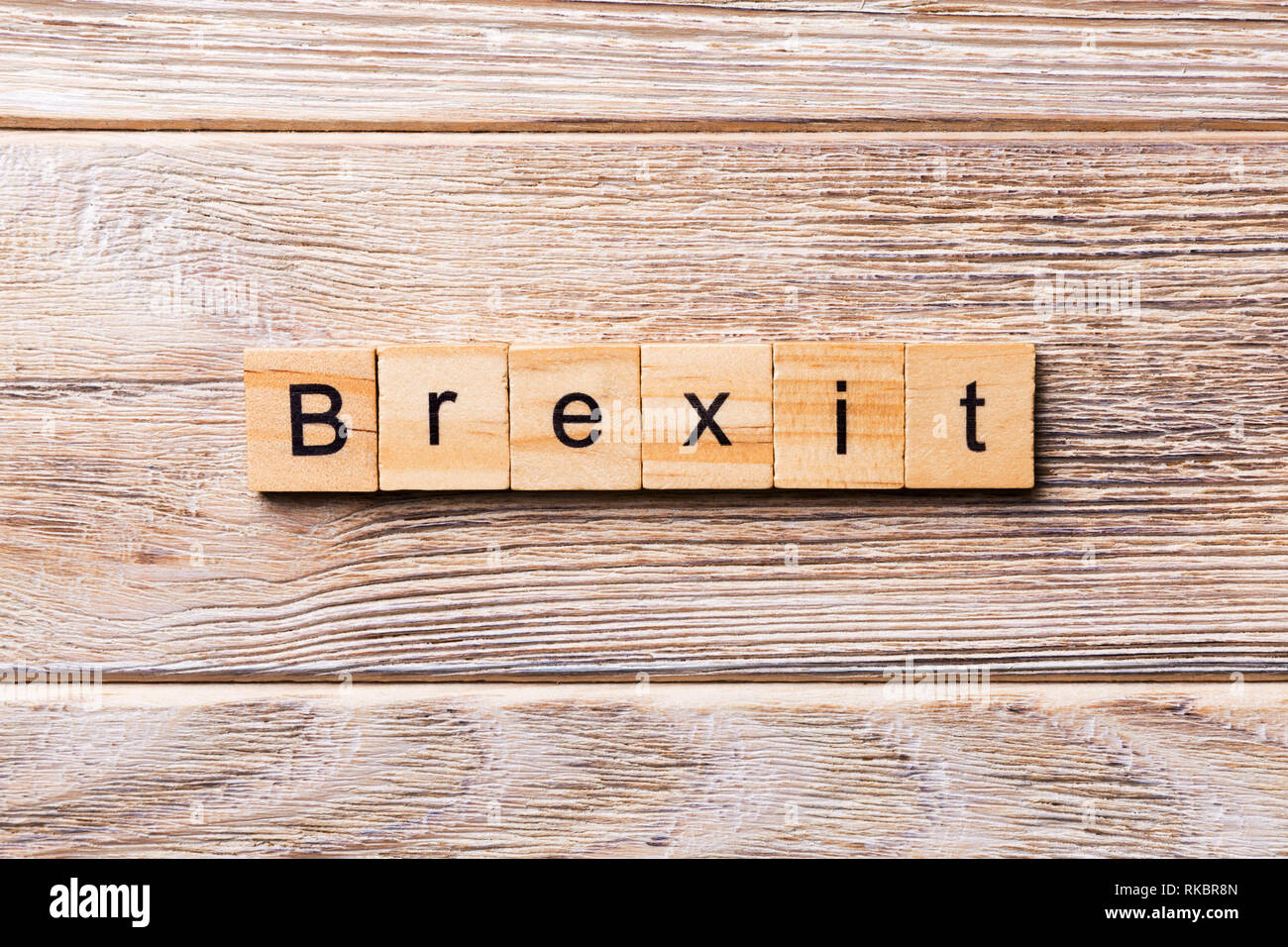 Brexit word written on wood block. Brexit text on wooden table for your ...
