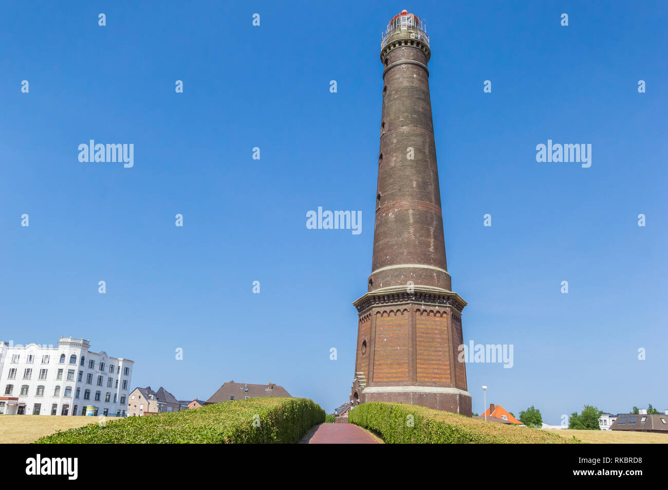 Path leading to the lighthouse in the center of Borkum, Germany Stock ...