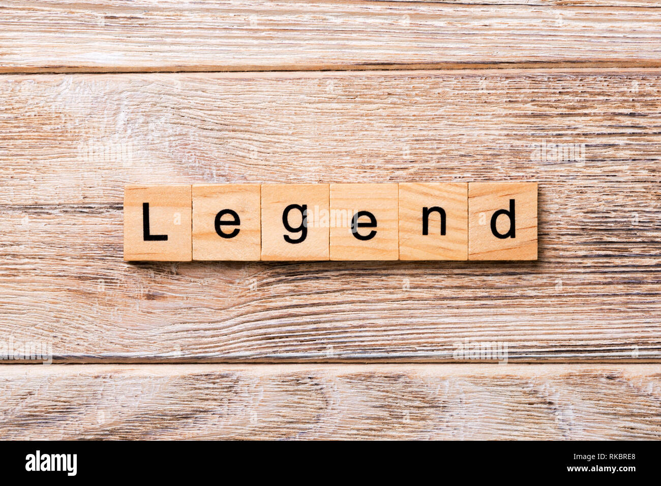 legend word written on wood block. legend text on wooden table for your ...